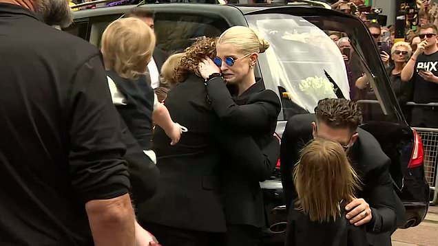 Kelly Osbourne breaks down in tears at emotional funeral procession