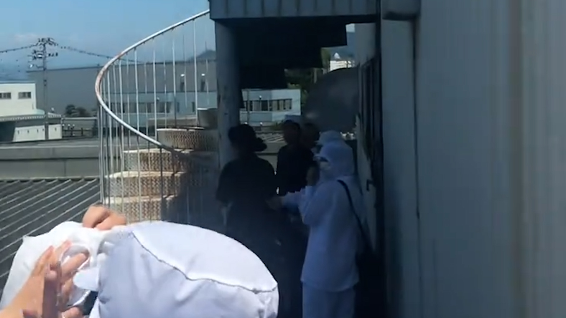 Residents take shelter on rooftoop after tsunami alert in Japan