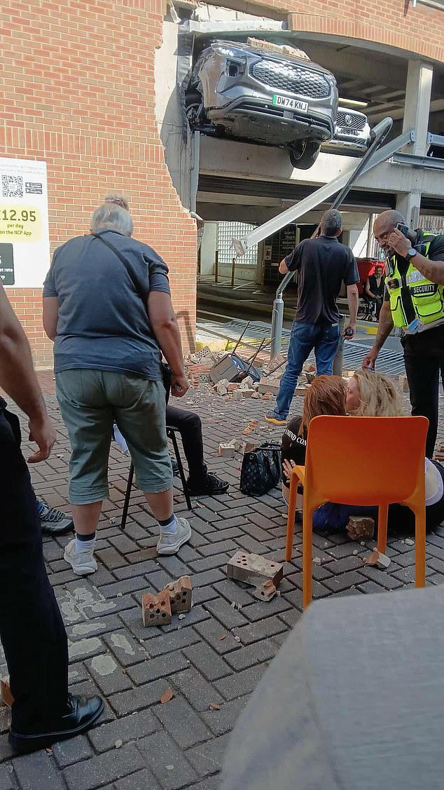 Pedestrians rushed to hospital after being hit by falling rubble when ...