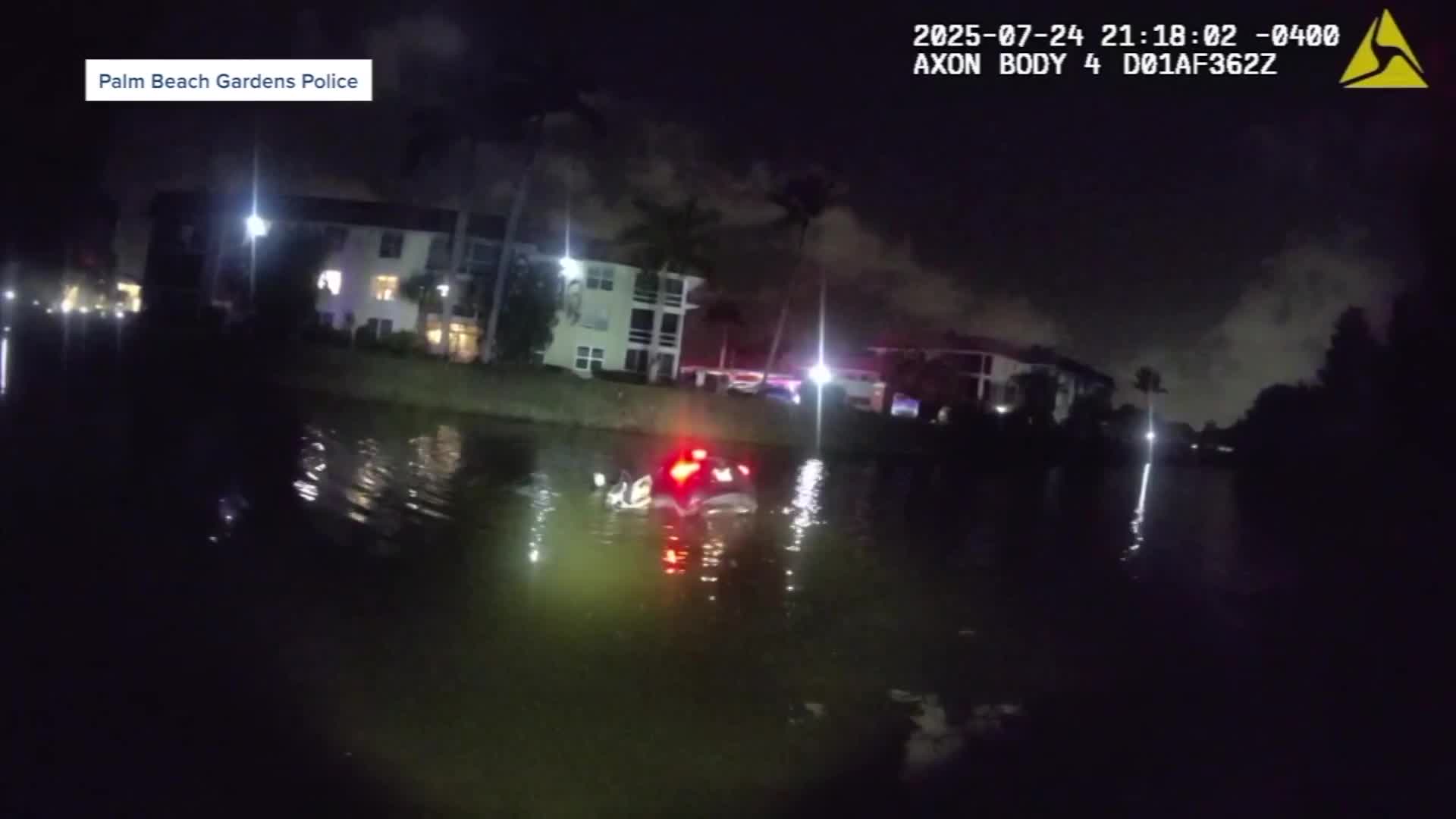 Police recount nighttime rescue of woman in submerged car