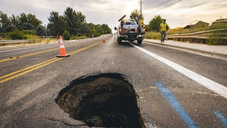 Sinkhole disrupts traffic on Floating Feather Road in Eagle
