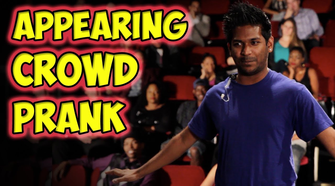 A crowd reacts as something appears out of nowhere