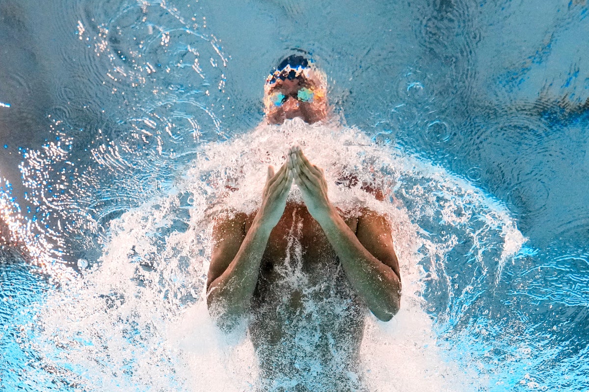Above and below: AP photographers cover all angles at the World Aquatics