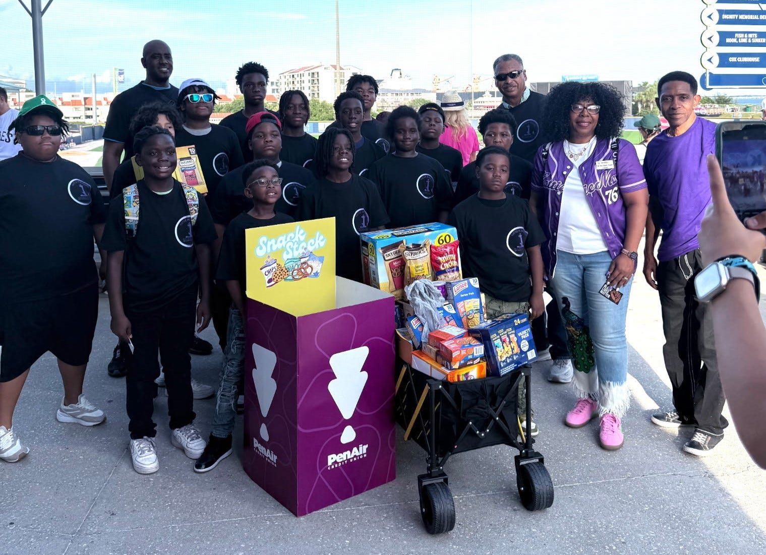 Nex-Gen Men of Distinction visit Blue Wahoos to aid snack drive ...
