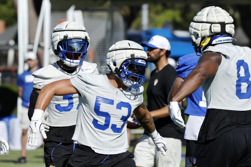 Rams linebacker Nate Landman wears his pride on body and helmet