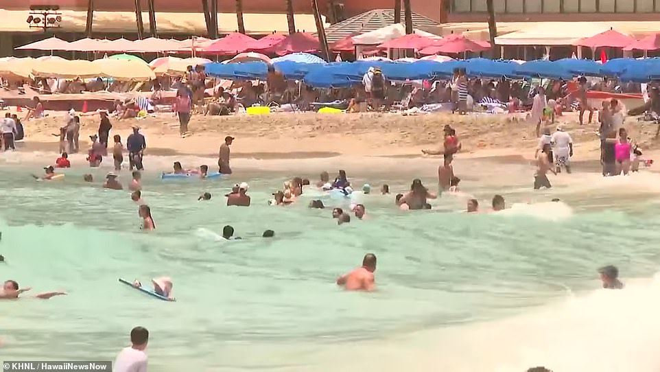 Swimmers ignore tsunami warning on Hawaii's Waikiki Beach