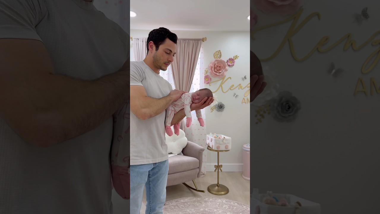 Nine Months Later—Dad Holding Baby Girl for First Time