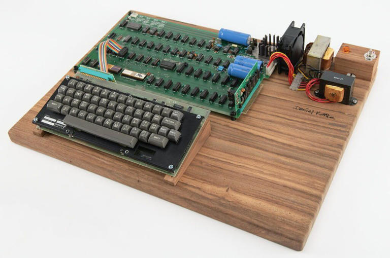 Operational Apple-1 and Steve Jobs cheque up for auction