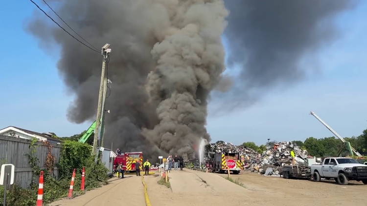 Crews fight large fire at auto salvage yard on Indy's west side