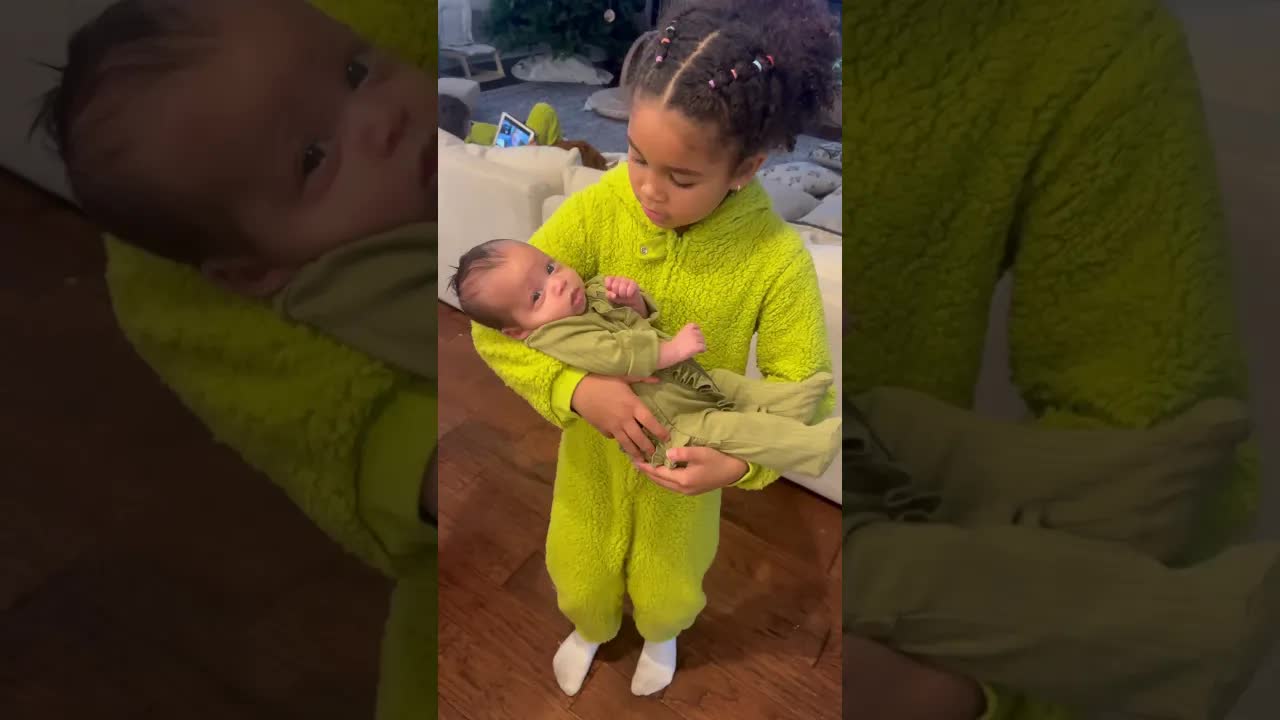 scarlett and tiania: adorable sisterly moment with baby scarlett