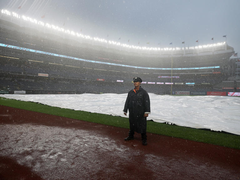 Torrential Northeast rain floods streets, strands New York City train ...