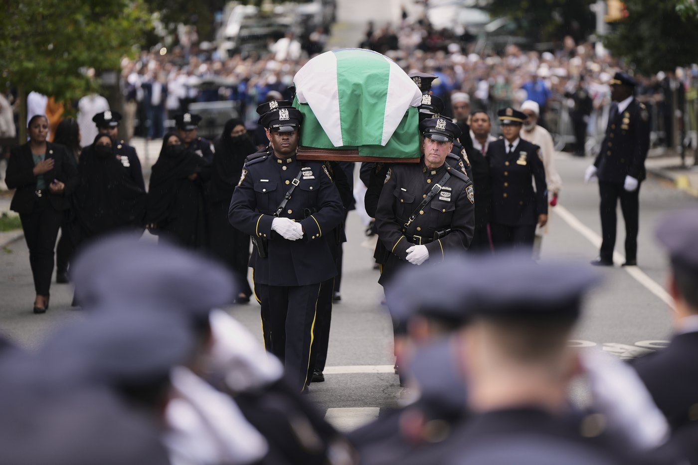 Mourners honor the NYPD officer killed in the attack at the NFL ...