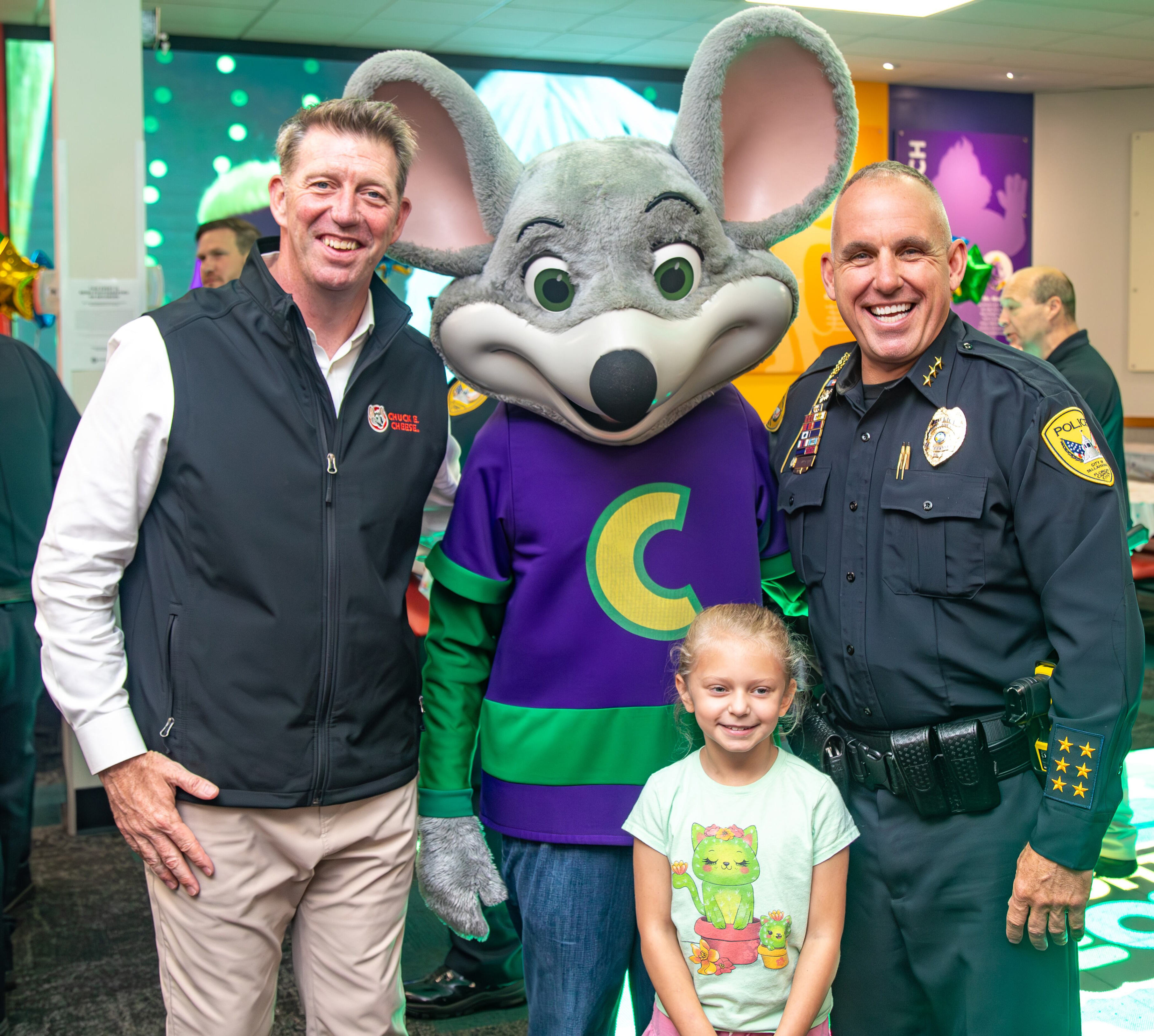 Mouse and police cheese for the camera as TPD and Chuck E. make amends ...