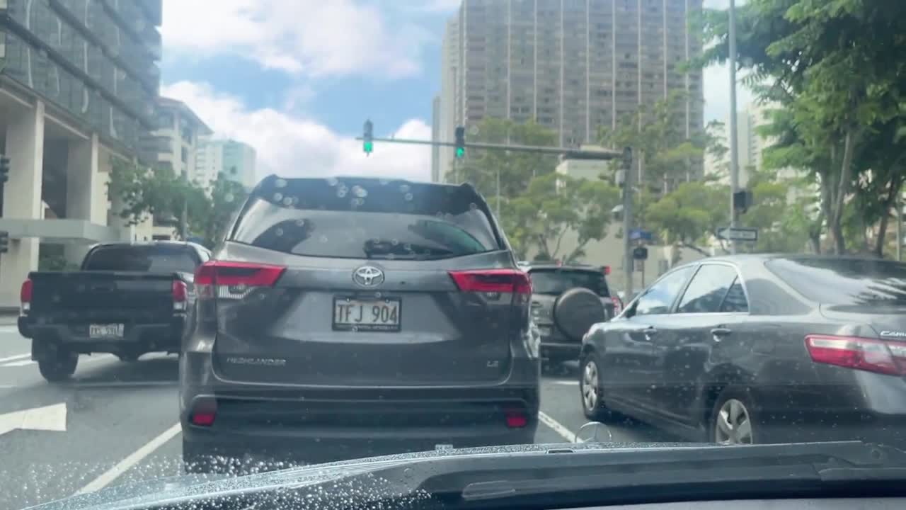 Heavy traffic flows calmly out of downtown in Honolulu, Hawaii, USA