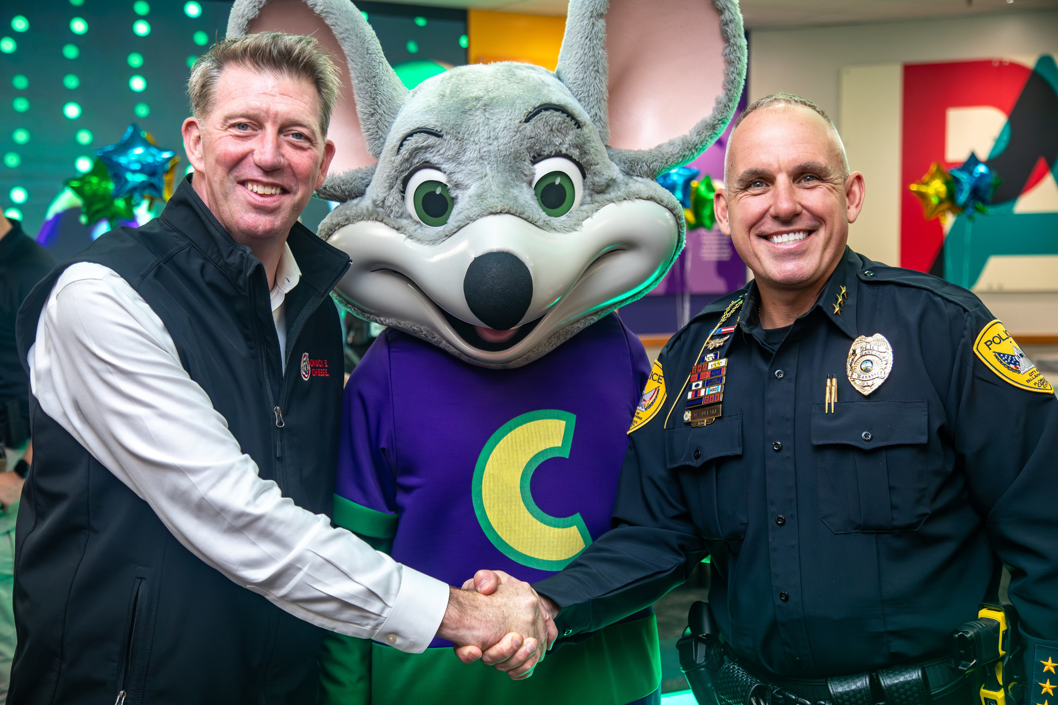 Mouse and police cheese for the camera as TPD and Chuck E. make amends ...