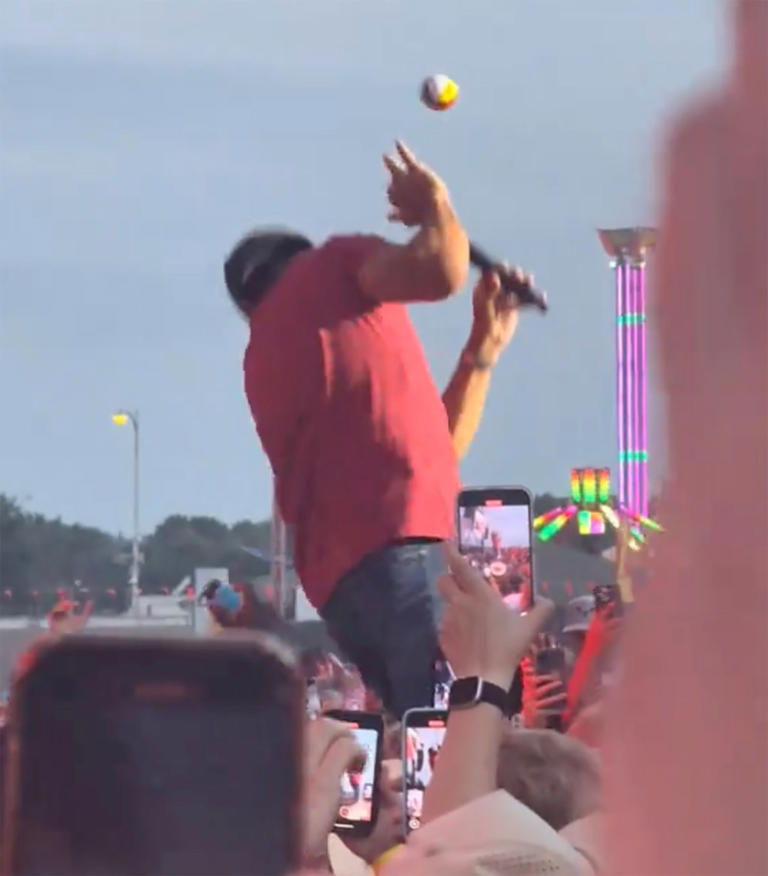 Luke Bryan responds after getting hit in the face with a ball mid-show
