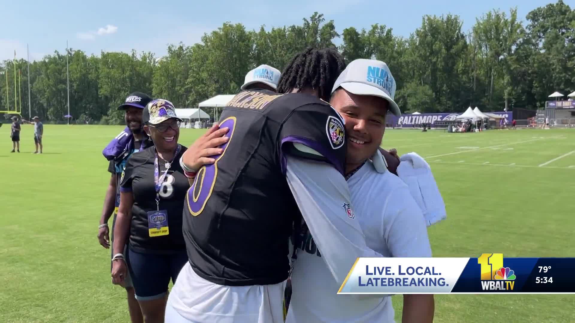 Teen battling brain tumors meets Ravens players at training camp