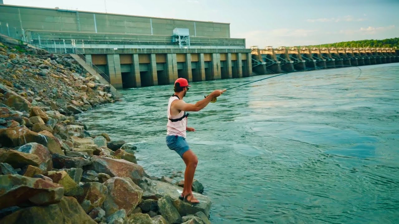 Raging spillway overflows with crazy fishing action