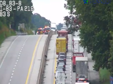 4 injured after tractor-trailer crash spills thousands of hot dogs on I-83