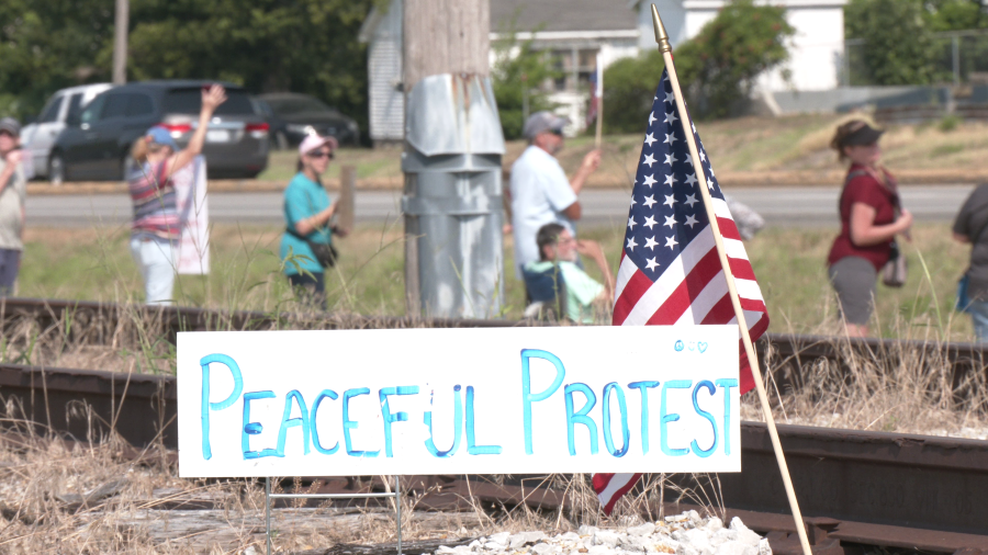 Demonstrators in Webb City protest deportation and funding cuts