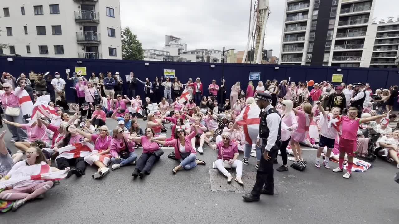 Anti Migrant Protestors sing Sweet Caroline as they block the road ...