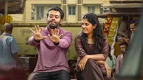 Thalavara second look shows Arjun Ashokan and Revathy Sharma in a ...