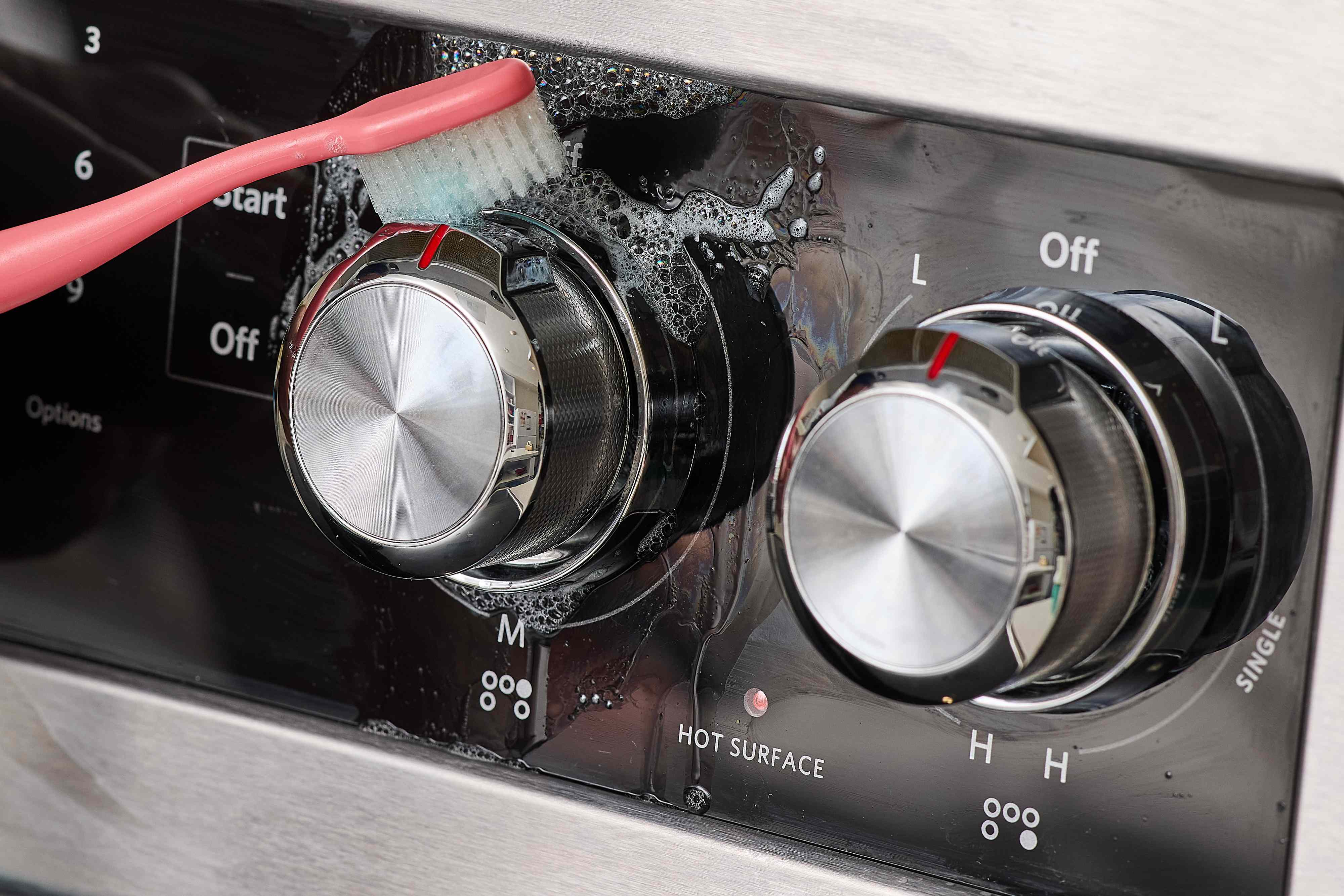 How to clean greasy stove knobs without removing them, according to ...
