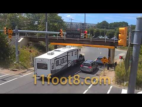 Watch as the 11'8" bridge eats an RV