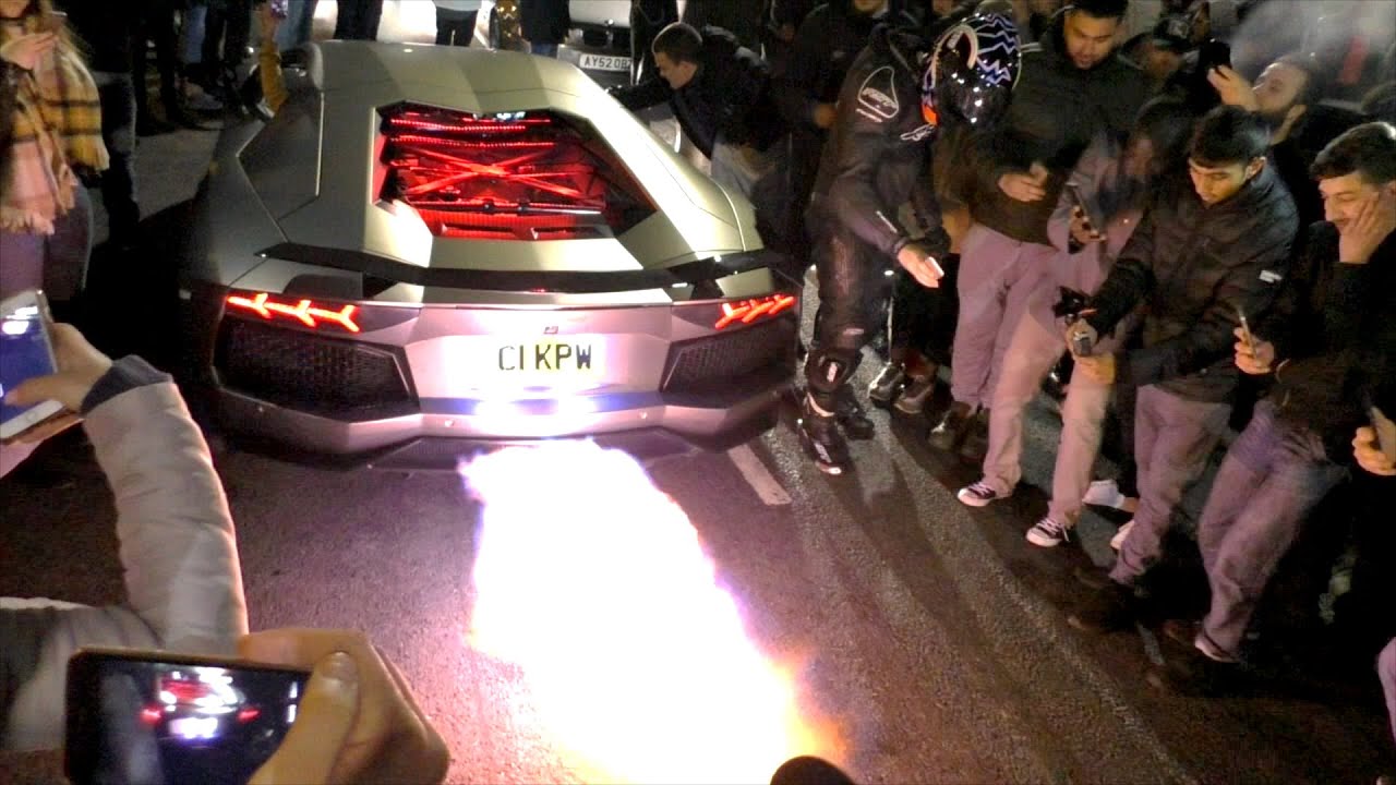 Supercars Revving with Exhaust Sounds and Flames