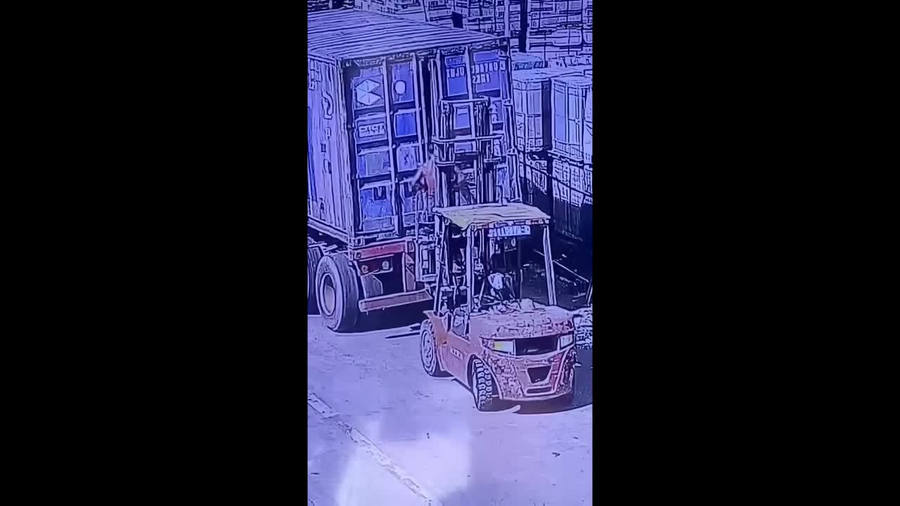 Worker's last-gasp escape as cargo topples out of truck's door