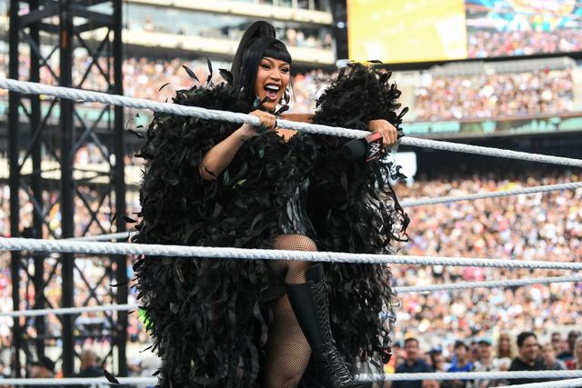 Cardi B Goes Goth Glam in Massive Edgy Feathered Cape with the Most ...