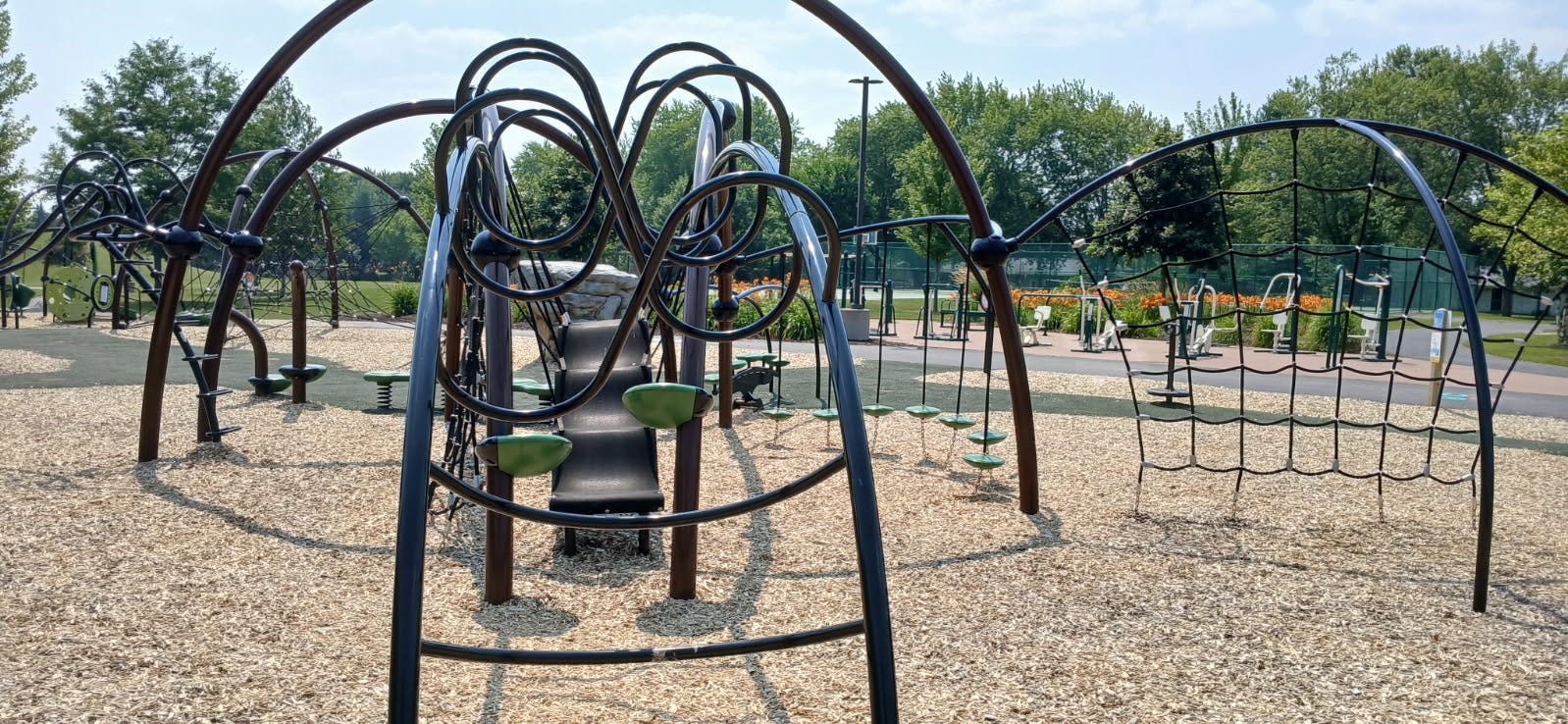 This Fox Crossing playground has plenty of features for kids and adults ...