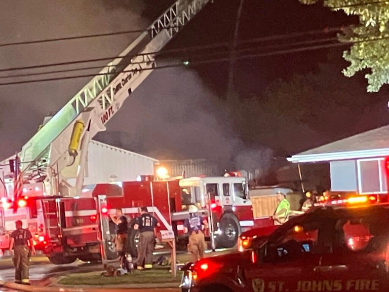 Pole barn catches fire in St. Johns early Tuesday morning