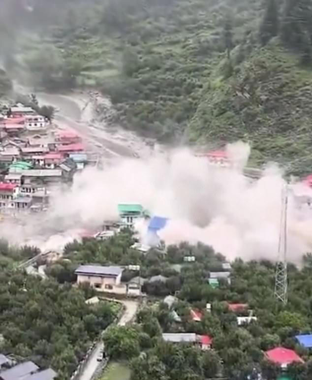 Terrifying moment village is washed away by cloudburst flash flood in ...