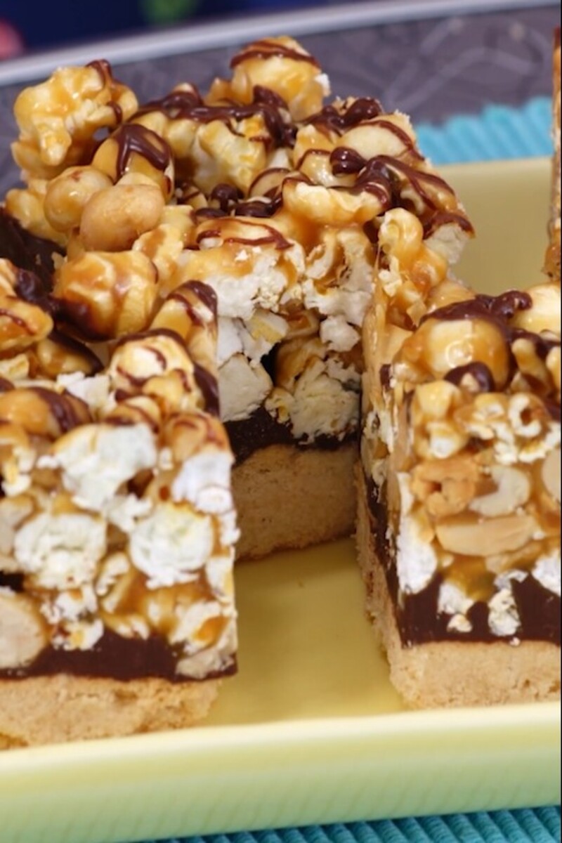 Peanut chocolate caramel popcorn bars with a buttery crunch