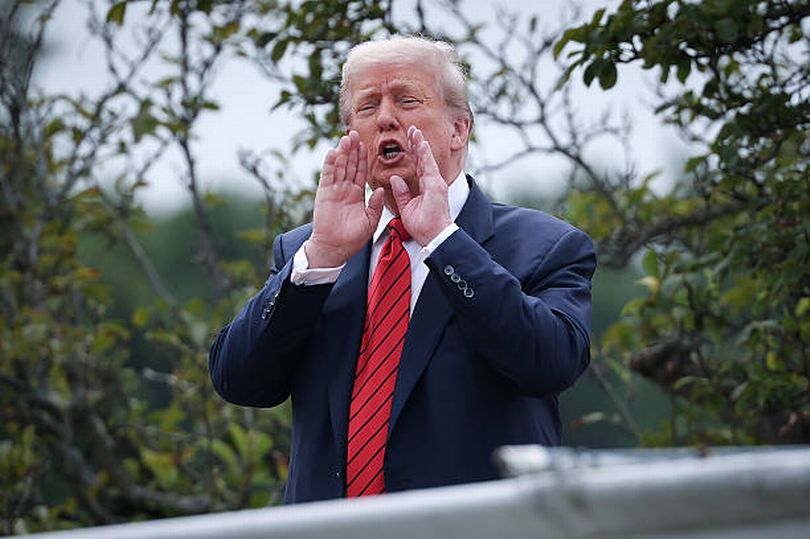 Trump sparks confusion as he yells and makes strange gestures while ...
