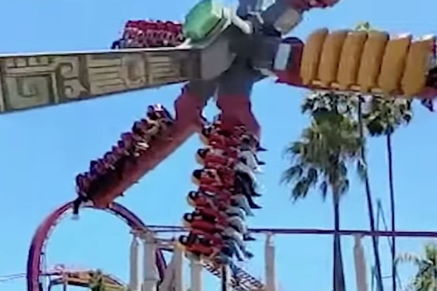 You have to see this! Amusement park ride stops mid-air with riders on ...