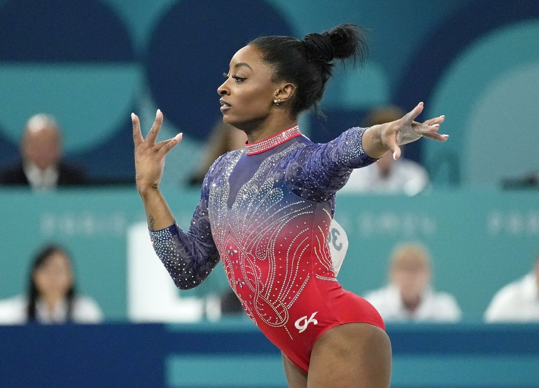 Simone Biles, gymnastics legend and SI swimsuit model, in photos