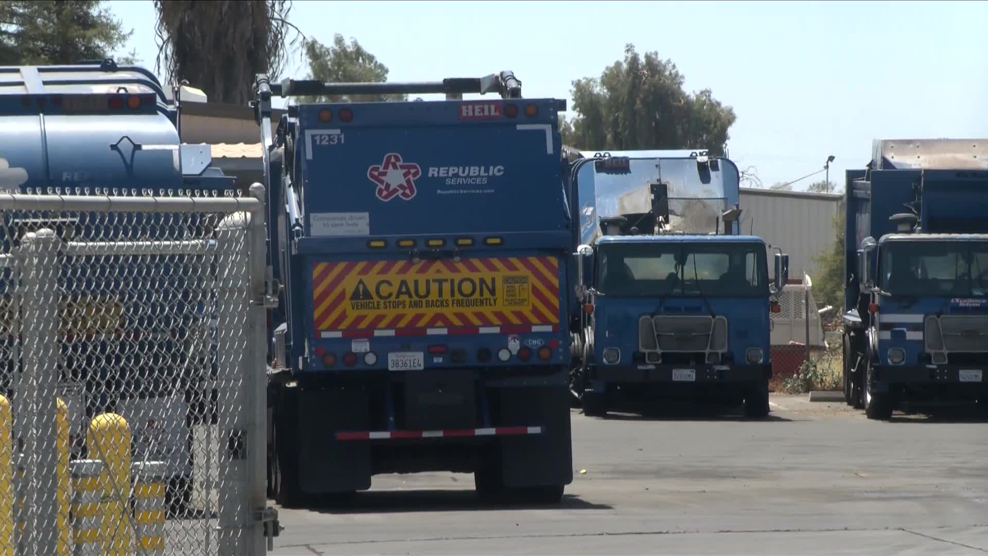 Garbage truck catches fire, empties load outside Fresno shopping center