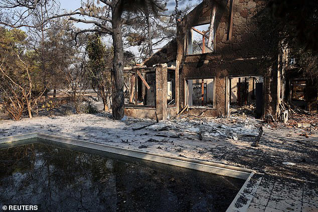 Out-of-control Cyprus wildfires bears down on tourist town