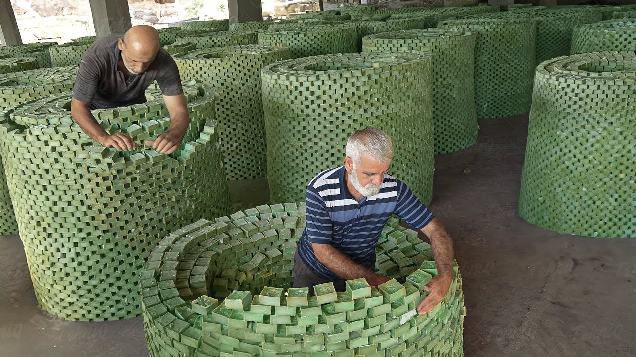 Hand-stacking millions of olive soap bars in an impressive method