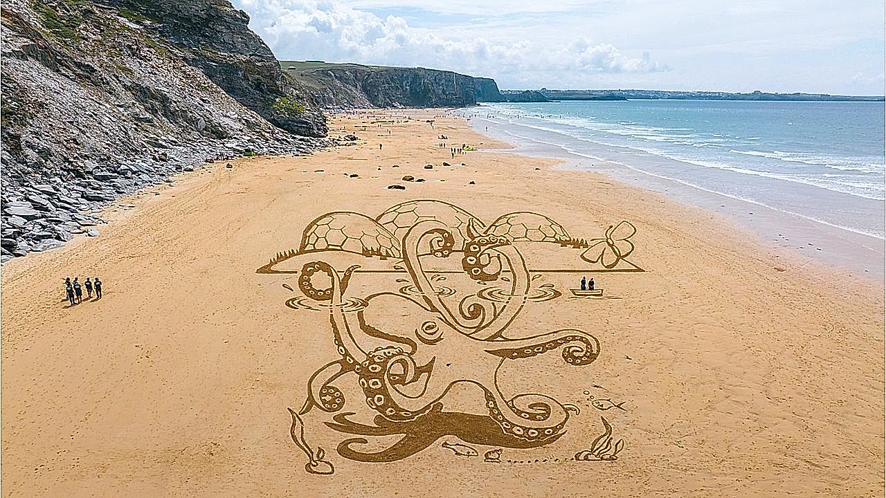 Giant octopus sand art graces Cornish shoreline