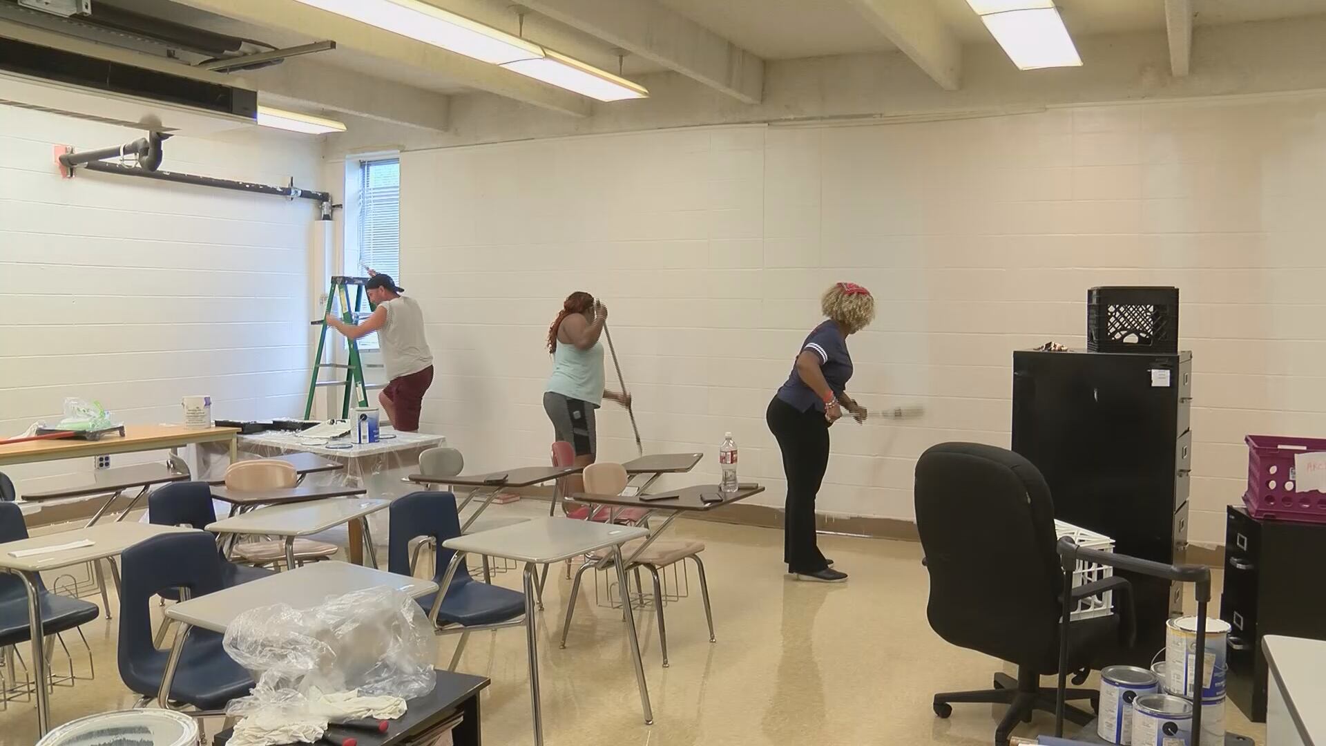 Educators gather for school painting at Capital City Alternative School ...