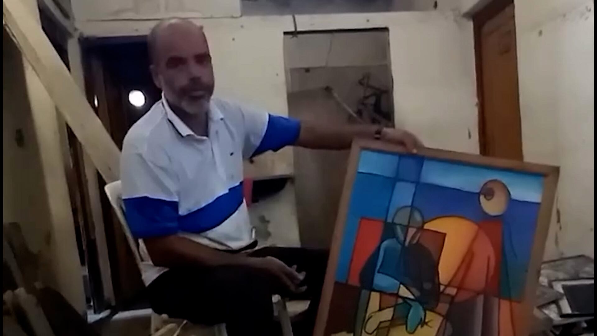 Palestinian artist destroys own paintings to help feed his family in Gaza