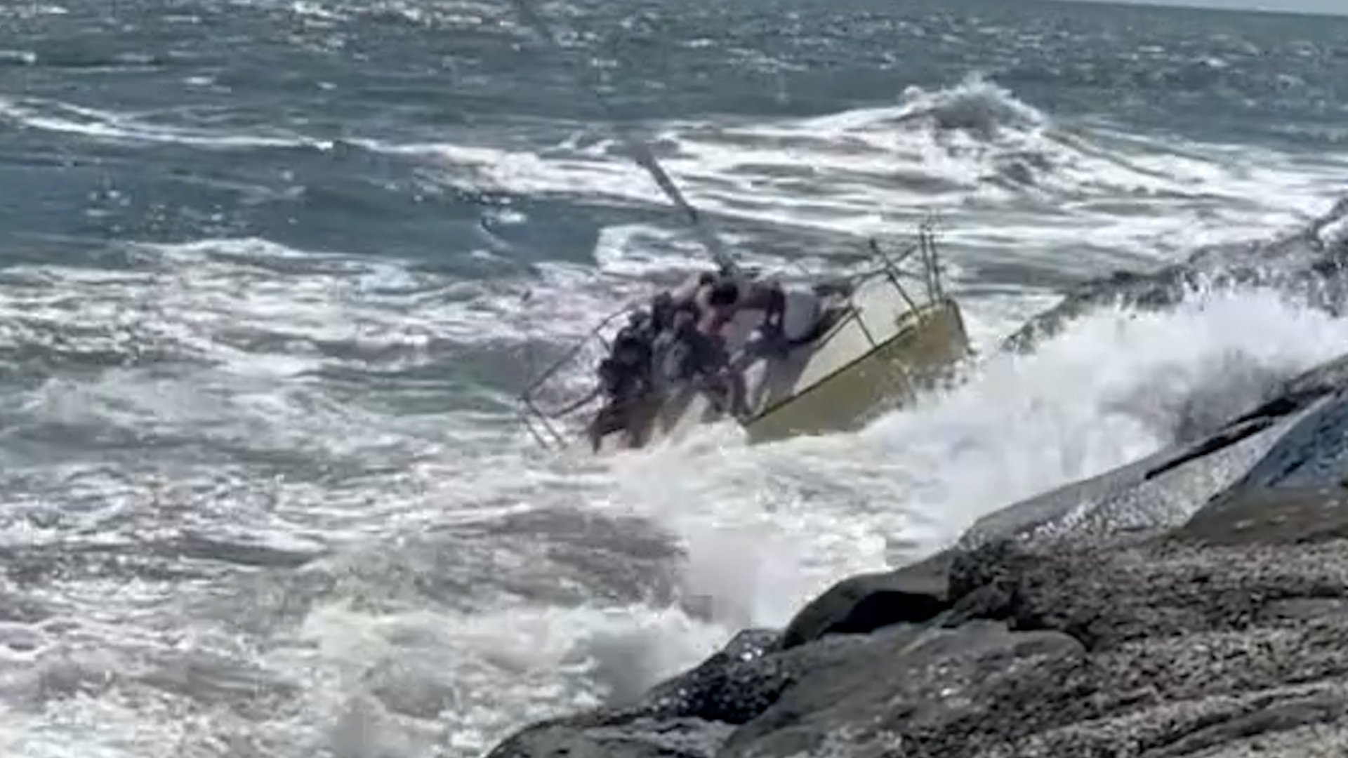 10 rescued after sailboat crashes into jetty