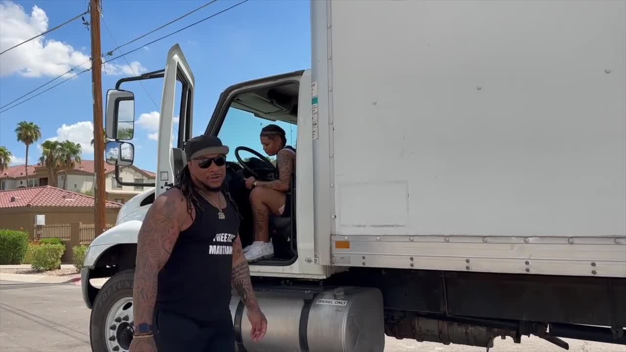 Man Shows off Impressive Strength by Pushing Box Truck