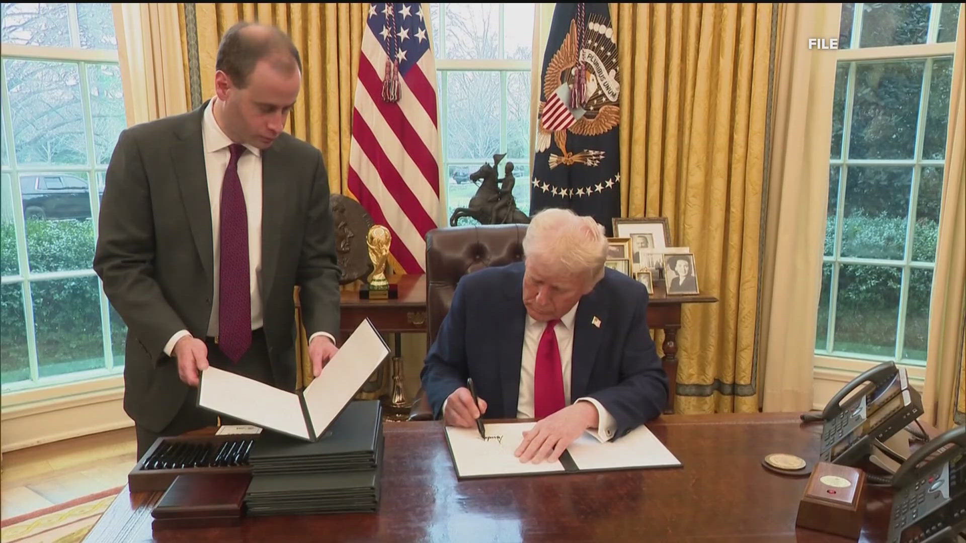 Trump signs spending cuts package into law