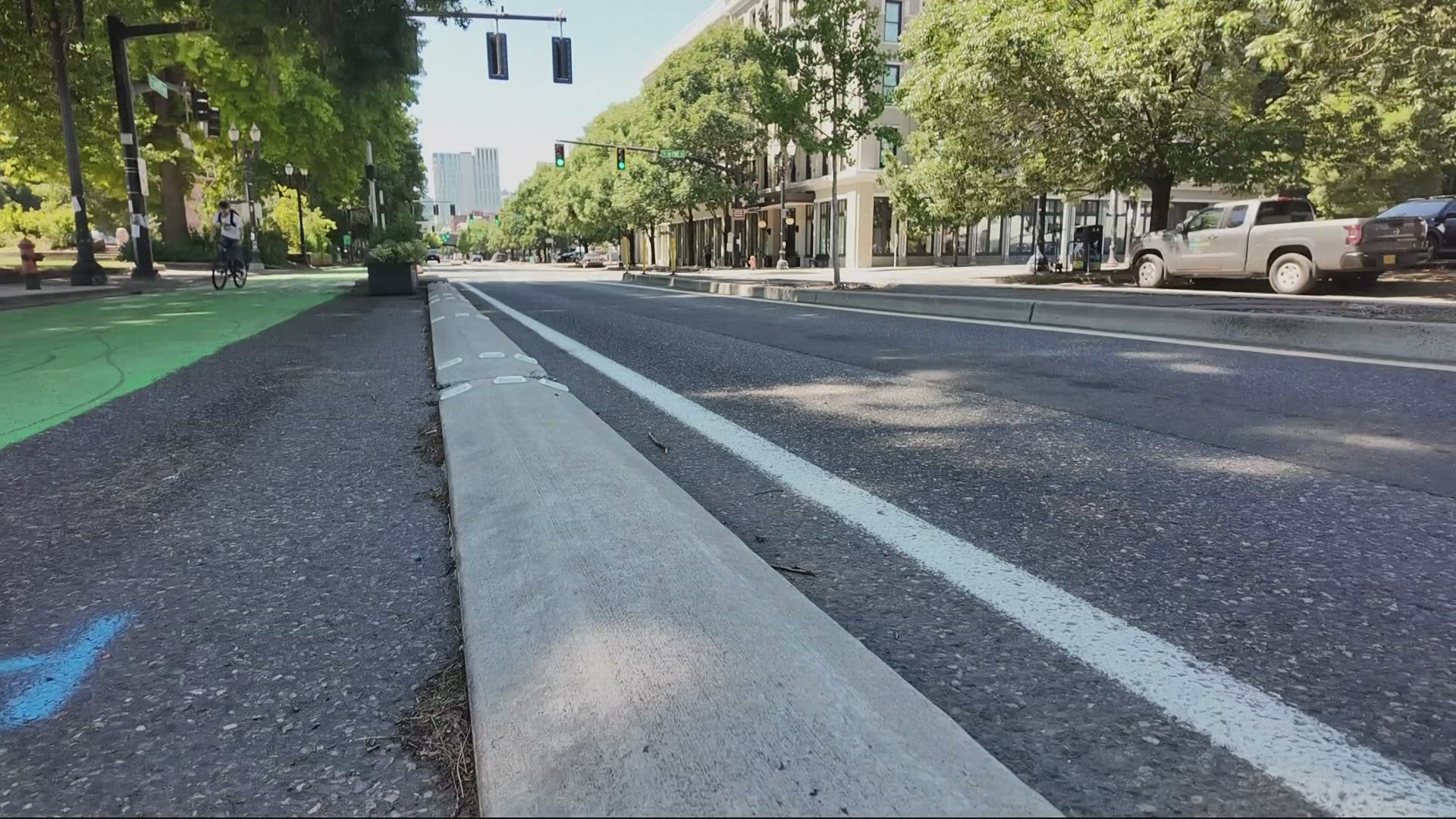 Cyclists applaud new bike lane barriers going in on some Portland streets