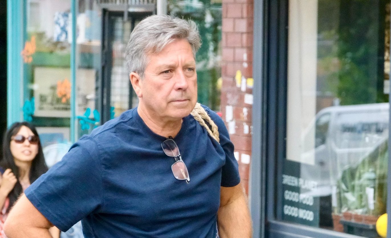 John Torode looks glum in first public outing