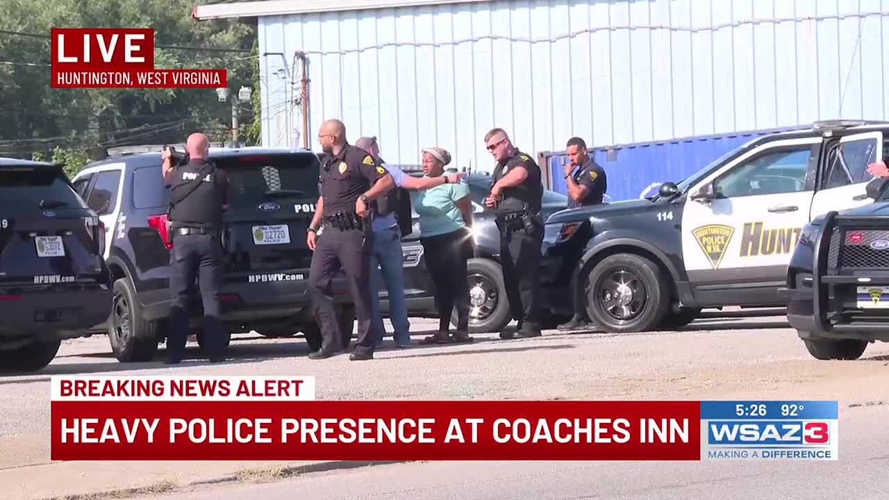 Armed robbery linked to large police presence near motel; one arrested